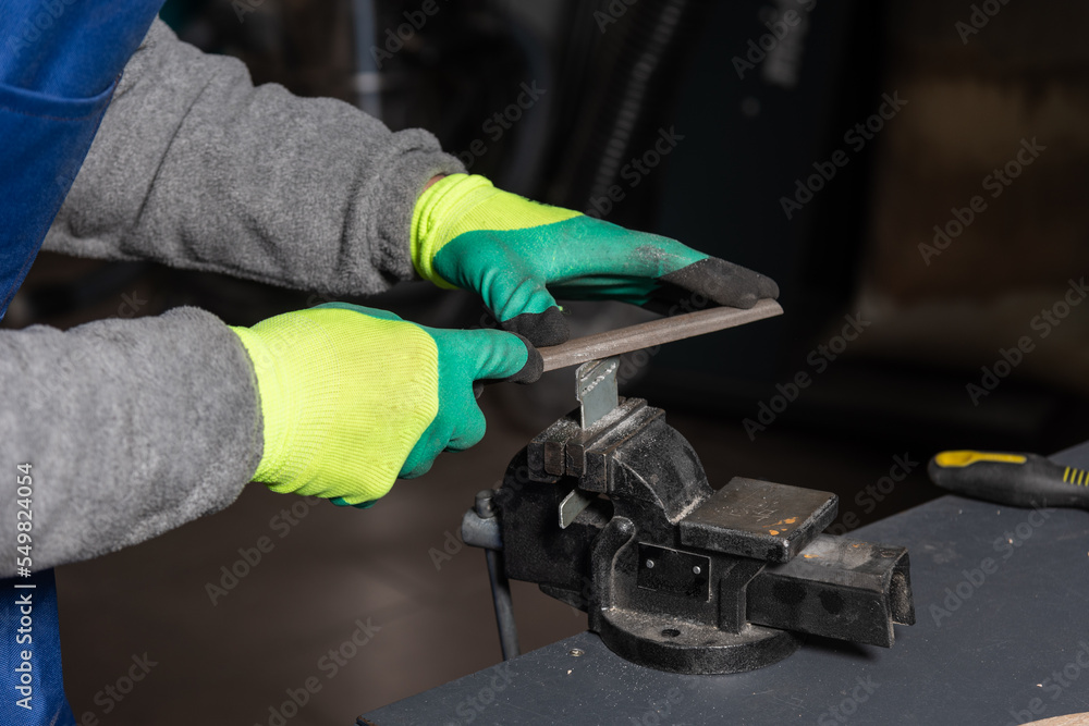 Working with file on the metal workshop Stock Photo | Adobe Stock