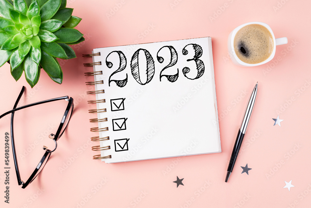 New year resolutions 2023 on desk. 2023 resolutions list with notebook ...
