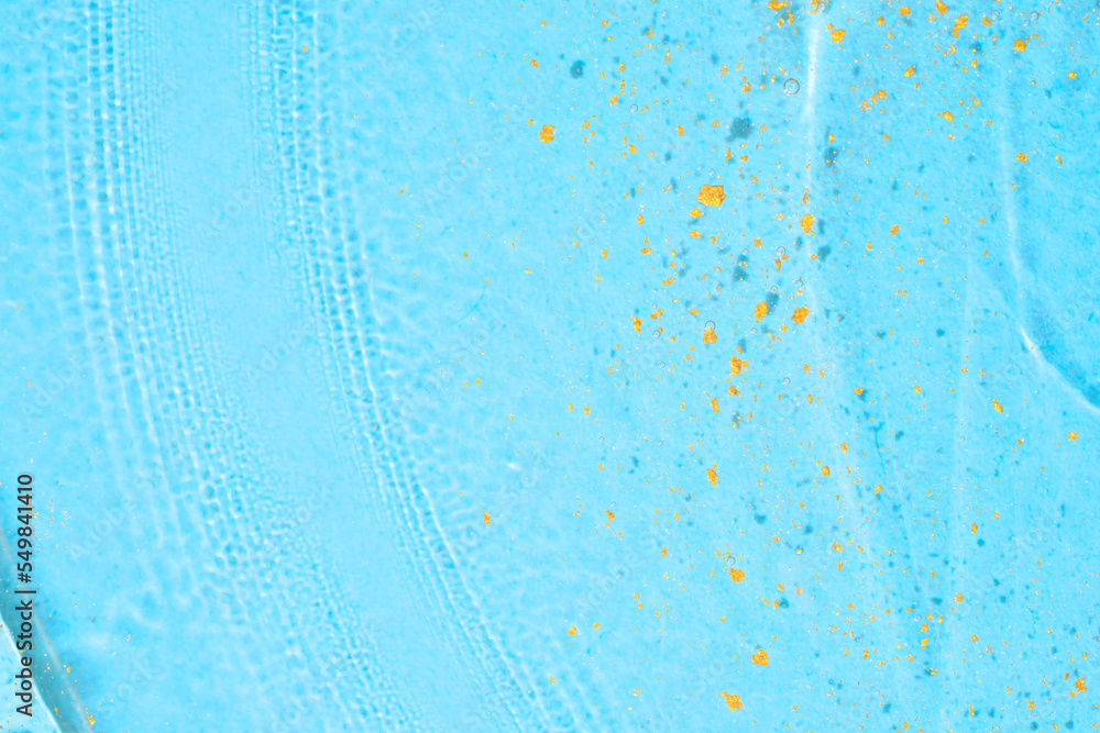 Blue liquid gel smudge and strokes with gold glitter particles ...
