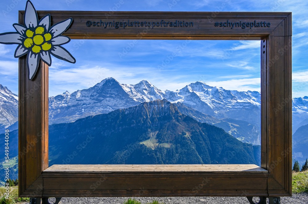 Wooden frame with a view on the mountain range Eiger Moench and ...