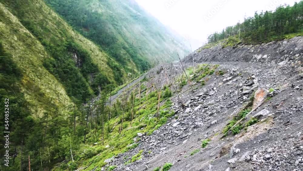 Siberia. Kolyma Range. Gorge (defile), stream and larch forest on the ...
