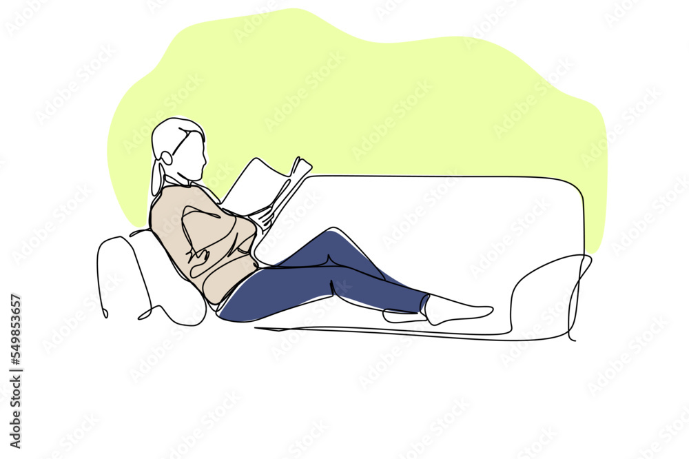 An adult female relax on the couch and reads a book. One continuous ...