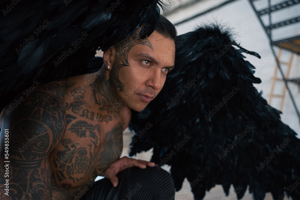 man portrait. Close up portrait of handsome male angel. Guy with tattoo ...