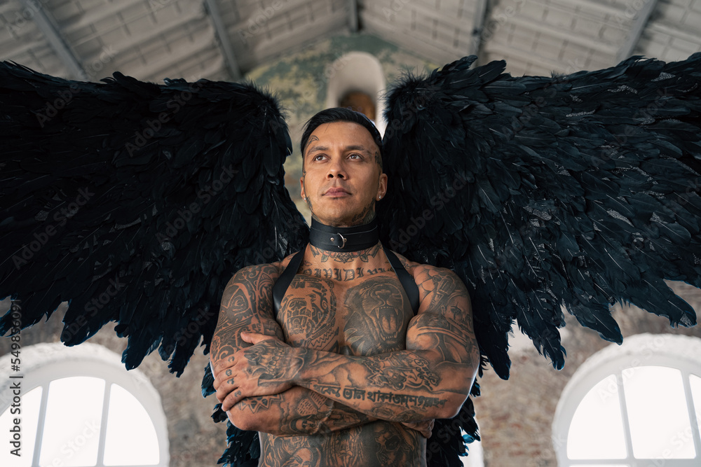 man portrait. Close up portrait of handsome male angel. Guy with tattoo ...