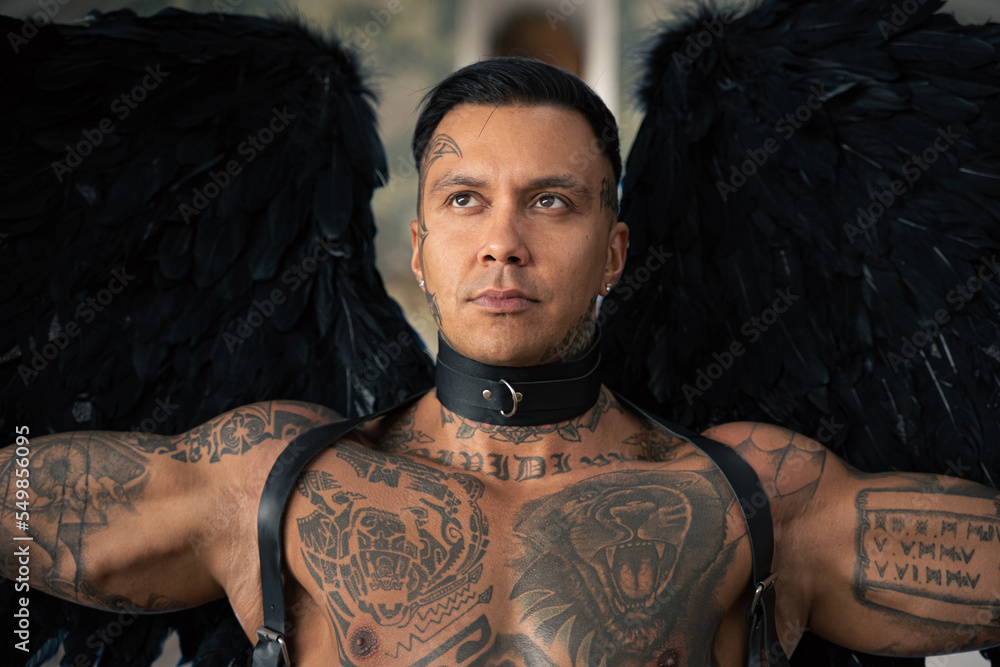 man portrait. Close up portrait of handsome male angel. Guy with tattoo ...