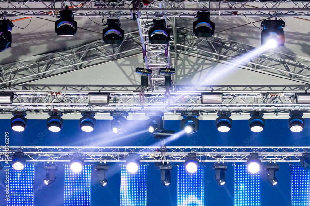 spotlights on outdoor concert stage with light beams. light beam at ...