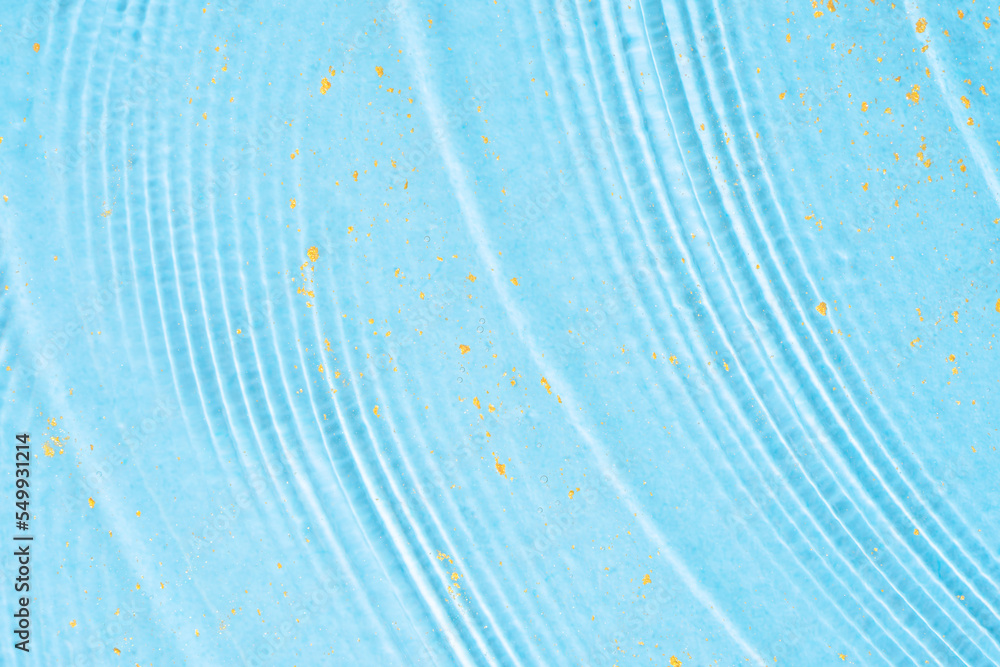 Blue liquid gel smudge and strokes with gold glitter particles ...