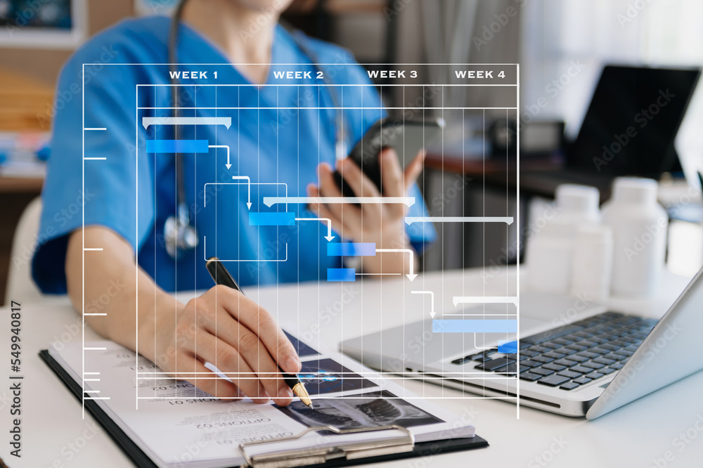 Project manager working and update tasks with Gantt chart scheduling ...