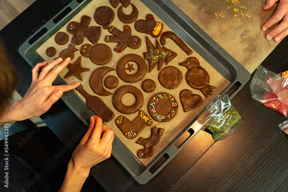 Top view of a baking sheet with gingerbread biscuits of different ...