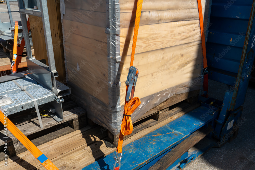 Tension safety belts with mechanical locks. On a pallet or in a ...