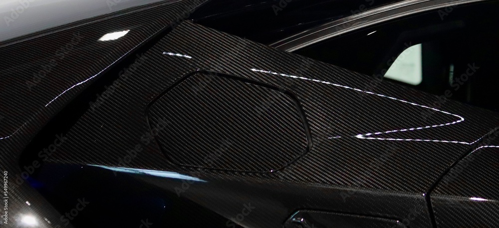 Sleek side view of carbon fiber sports car. Supercar background. Car ...