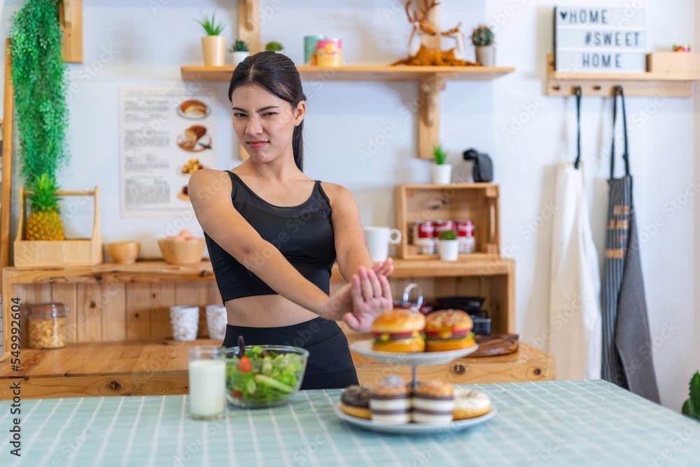 Say no to carbohydrates and junk food. Young asian beautiful female ...