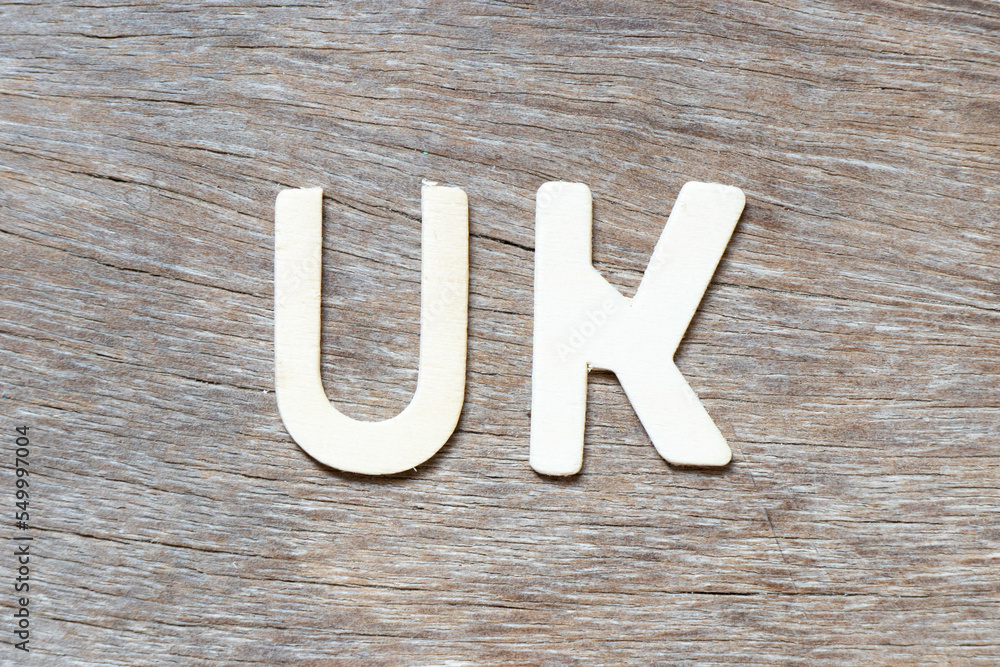 Alphabet letter in word UK (abbreviation of united kingdom) on wood ...