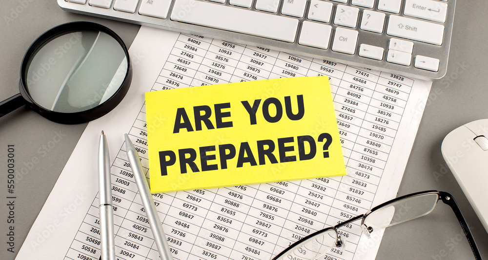 ARE YOU PREPARED text written on a sticky on chart with keyboard and ...