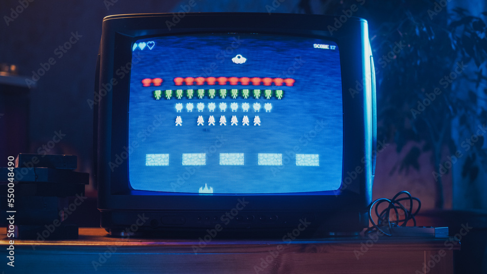 Close Up Footage of a Retro TV Set Screen with an 8 Bit 2D Eighties ...