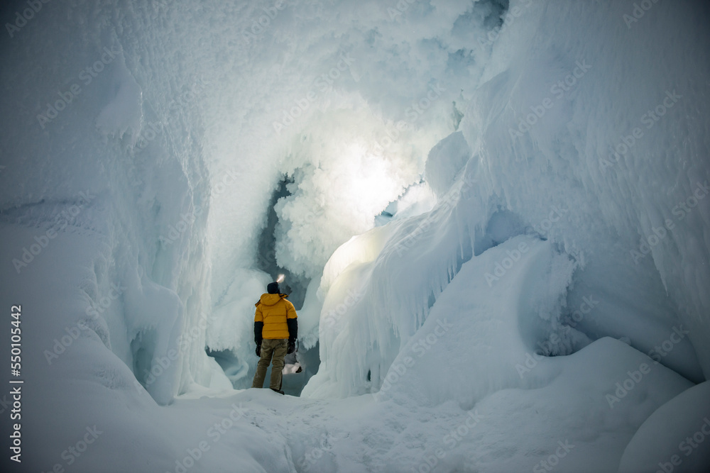 Exploration of an ice cave in Antarctica. Stock Photo | Adobe Stock