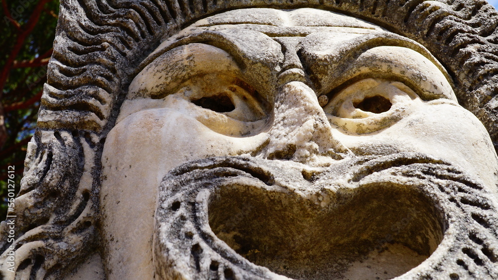 Ornamental mask in marble from the Roman era in the archaeological site ...