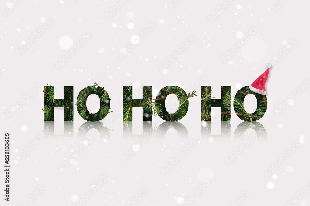 Santa ho ho ho sound made of a fir branch with Santas hat in the end ...