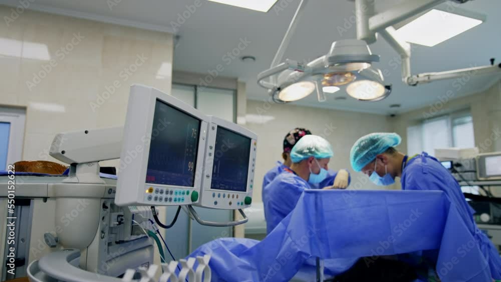 Patient’s condition monitored by the medical equipment with screens ...