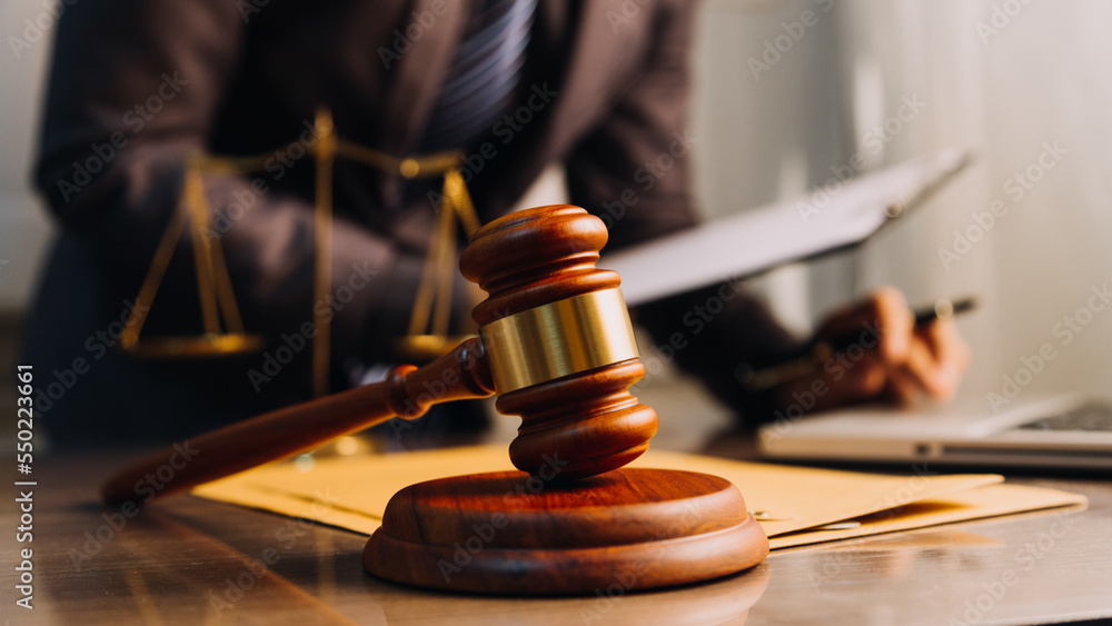 Justice and law concept.Male judge in a courtroom with the gavel ...