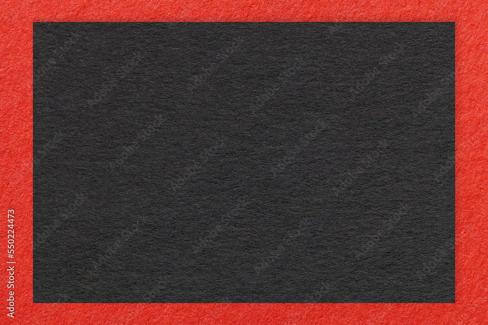 Texture of craft black color paper background with red border, macro ...
