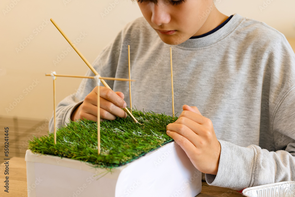 Boy workshop school project create soccer field with artificial grass ...