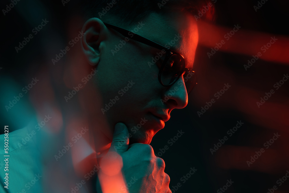 Cinematic night closeup portrait of handsome man neon lights. Fashion ...