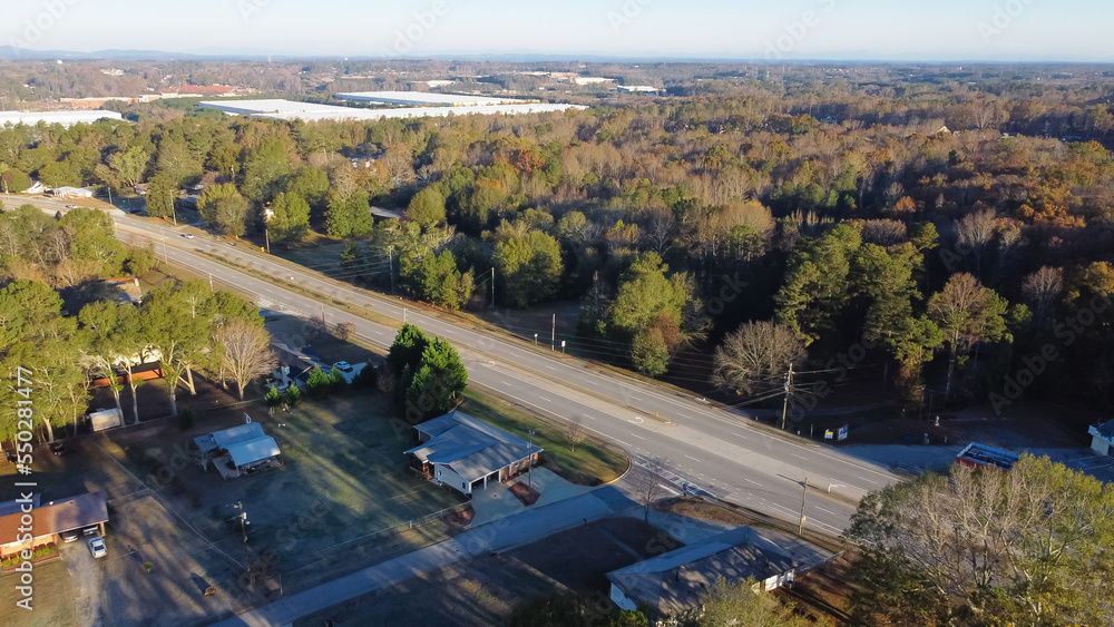 Residential area single family homes situated woodland lush green tree ...