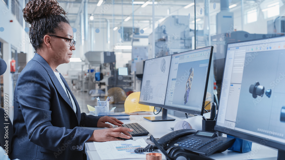 Factory Office Facility: Industrial Engineer Drafting Blueprints of a ...