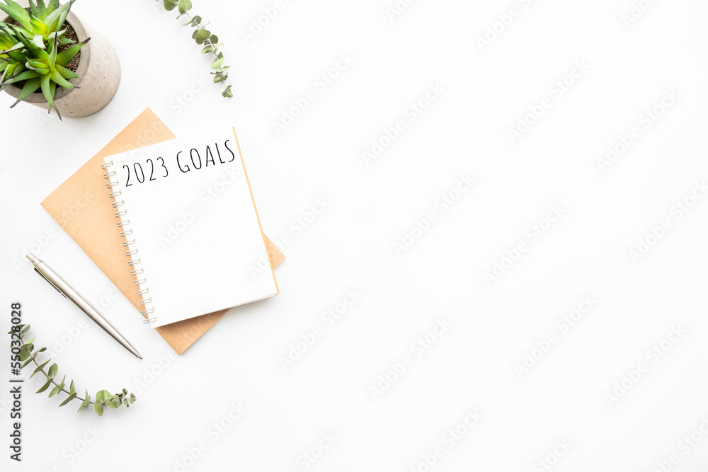 Notebook with 2023 goals text on it to apply new year resolutions and ...