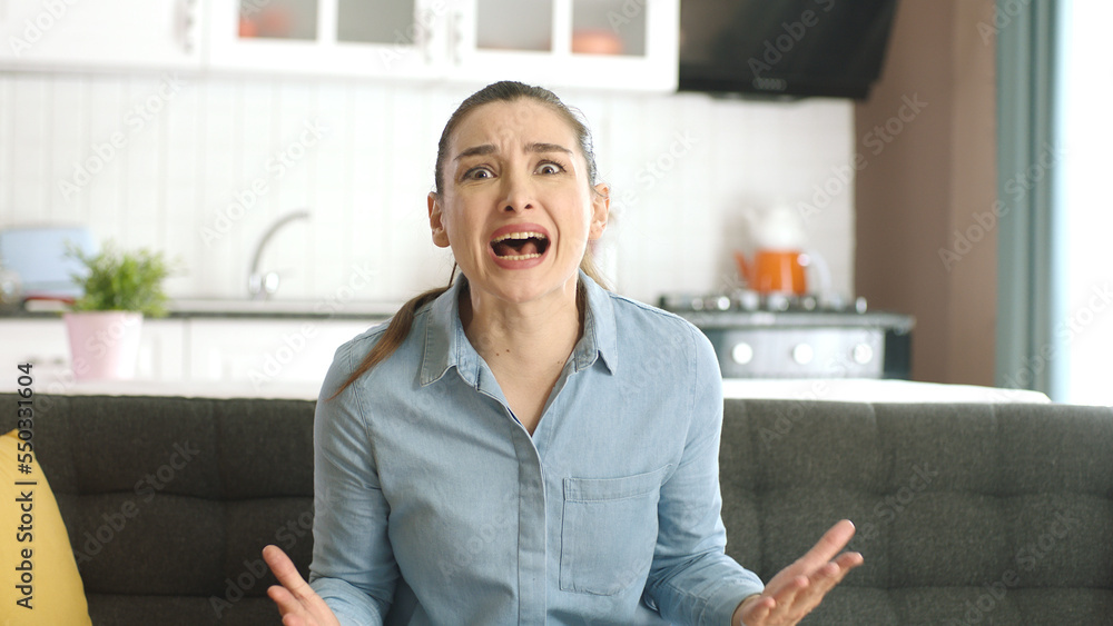 Young woman arguing and shouting angrily reacts to her lover or husband ...