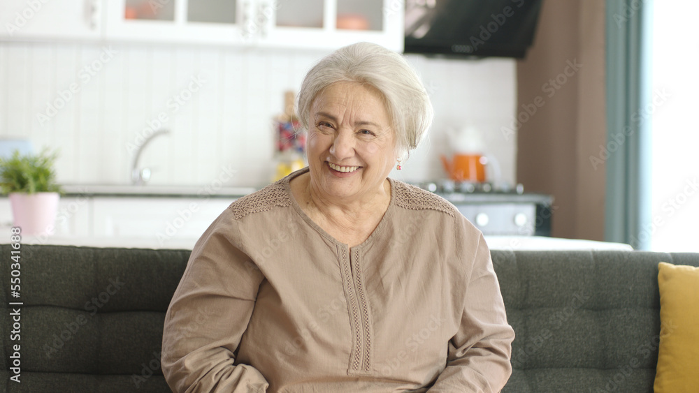 Peaceful old woman resting in her quiet home. Lonely elderly woman ...