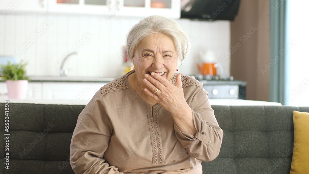 Peaceful old woman resting in her quiet home. Lonely elderly woman ...