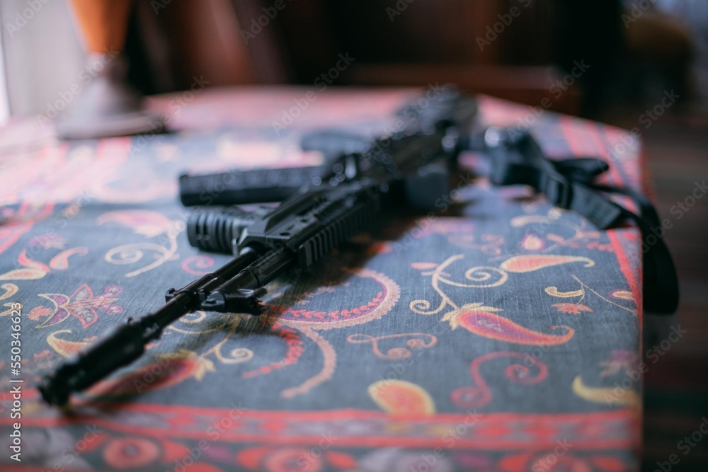 Armed negotiations. Holding hostages. A firearm, a submachine gun is ...