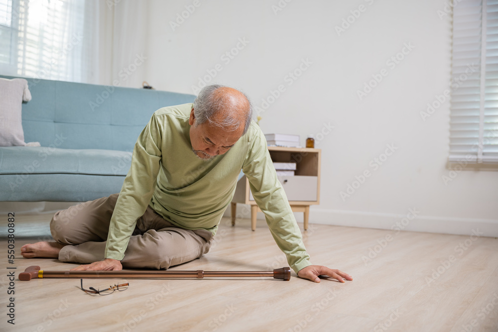 Older senior man headache lying on the floor after falling down he pain ...
