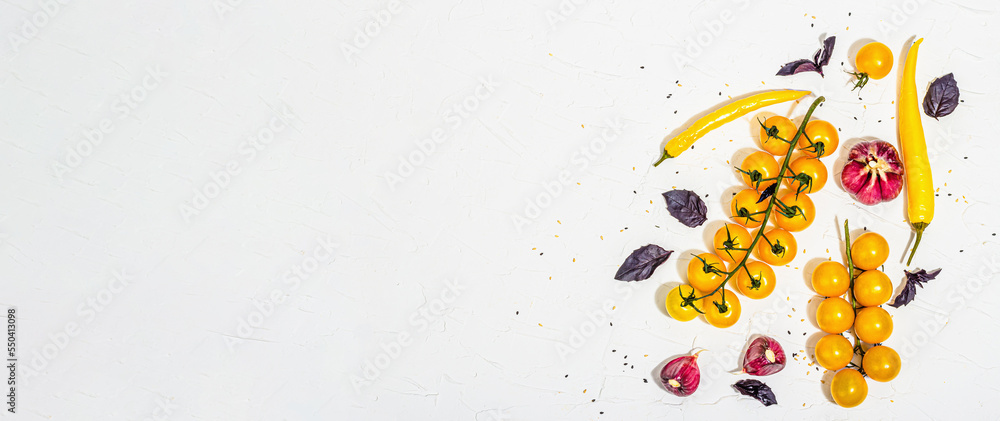 Culinary background with ripe vegetables. Yellow tomato cherries, chili ...