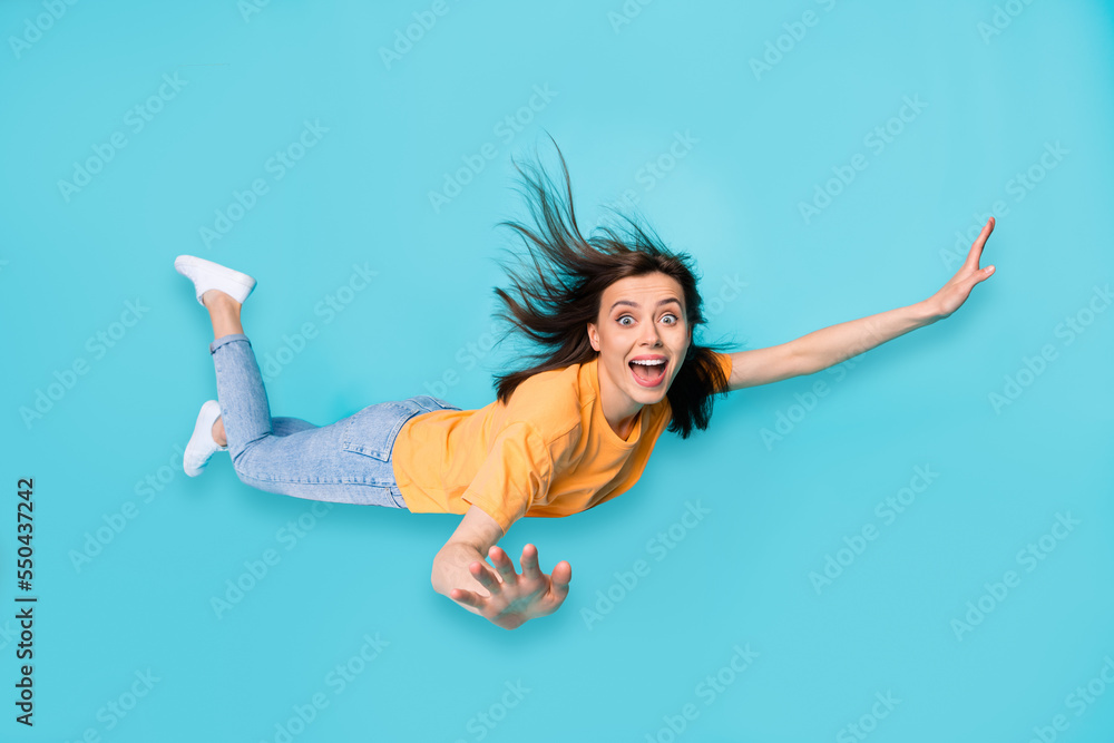 Full length photo of astonished girl impressed open new skills can fly ...