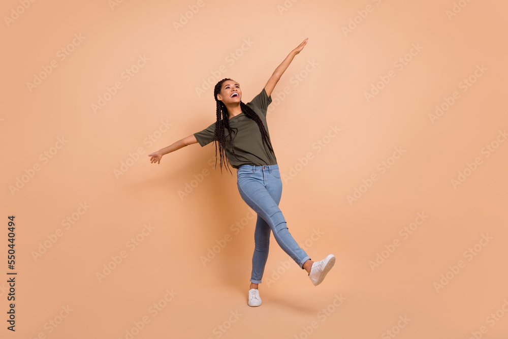 Full body photo of overjoyed cheerful person dancing raise hands toothy ...