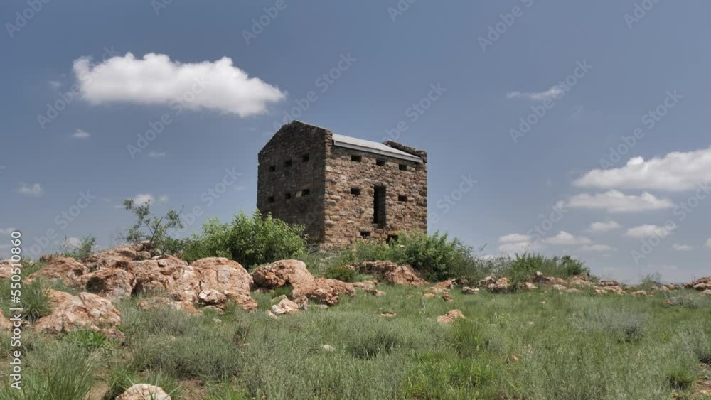 Cloud drifts over historic Boer War stone masonry blockhouse, South ...
