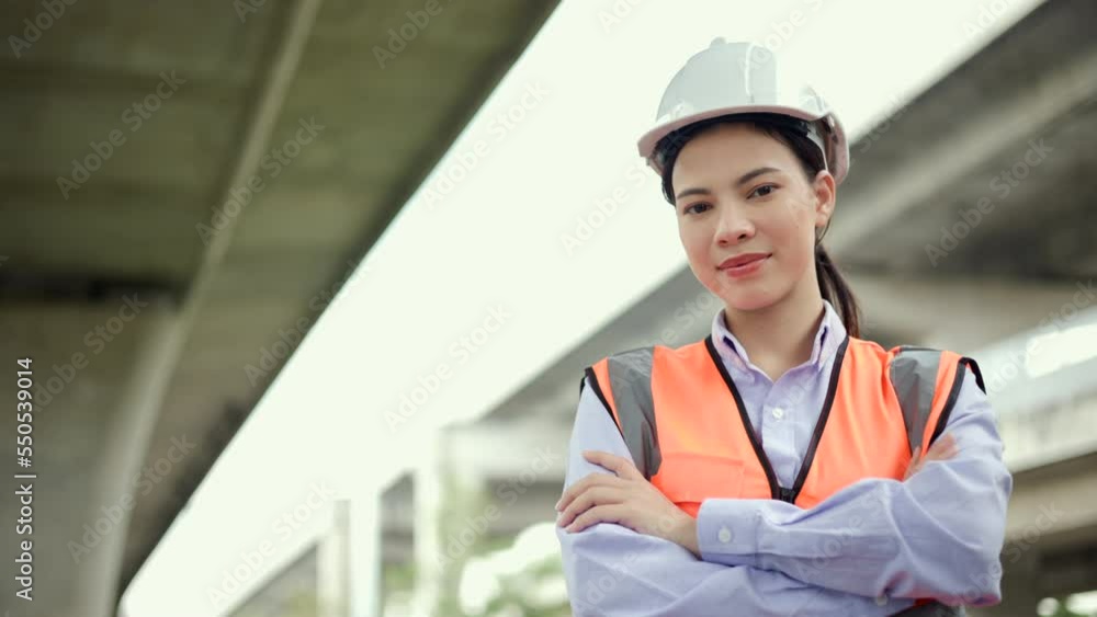 Confident woman Engineer or architect looking camera with white safety ...