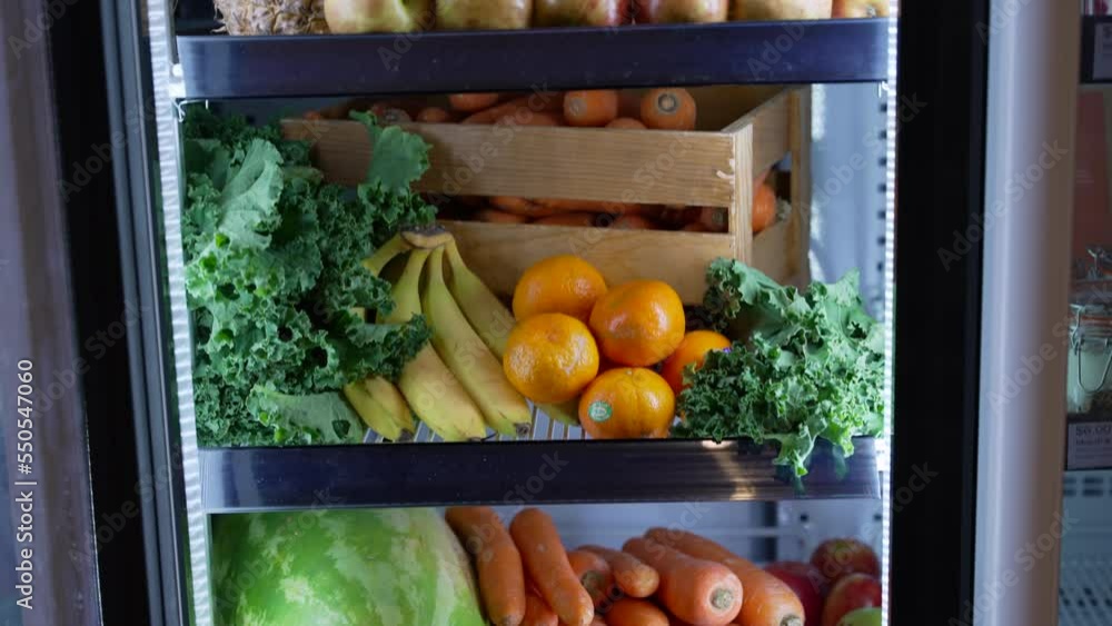 Close up shot of close fridge filled with green vegetables and ...