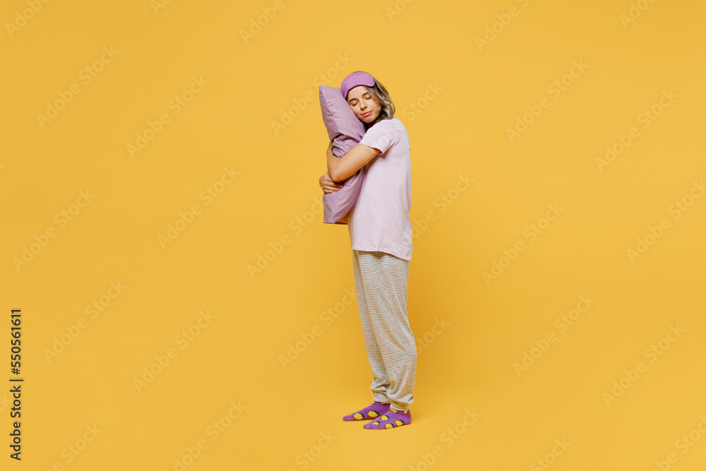 Full body young tired sleepy calm woman she wears purple pyjamas jam ...