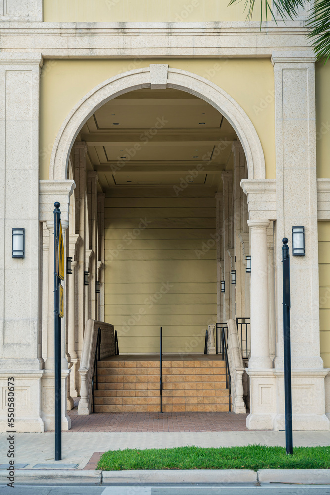 Arched columns at the entrance of a passage with stairs at the front in ...