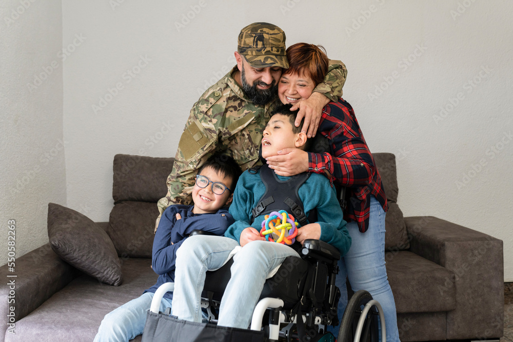 Latin Family of four with military soldier father and disabled child in ...