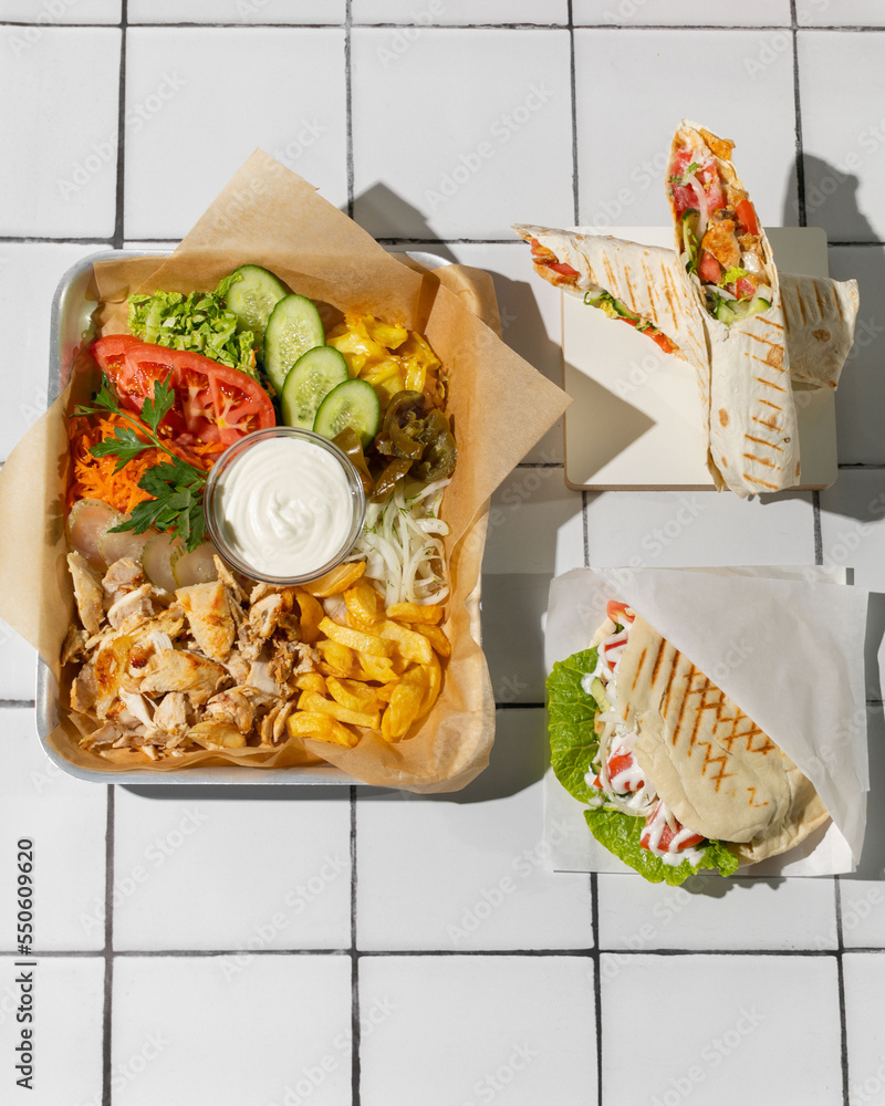 Mix of shawarma: opened shawarma on plate, shawarma in pita and classic ...