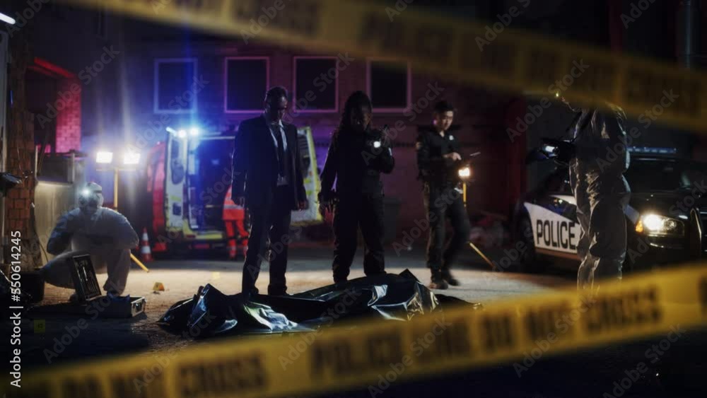 Zoom Into a Crime Scene at Night: Crime Scene Investigation Team Working on a Murder. Female ...