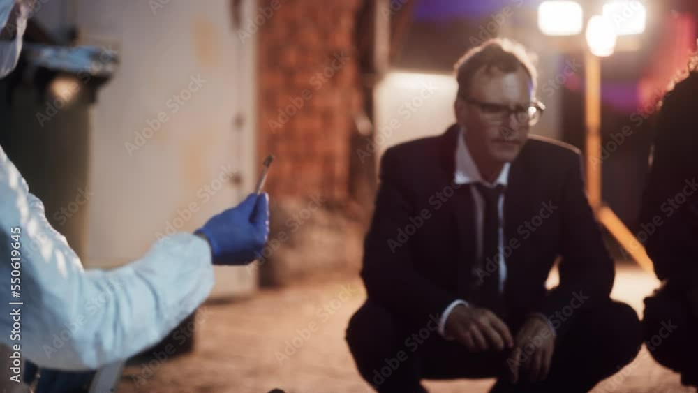 Crime Scene Investigation Team on Duty: Forensics Specialist Lifting a ...