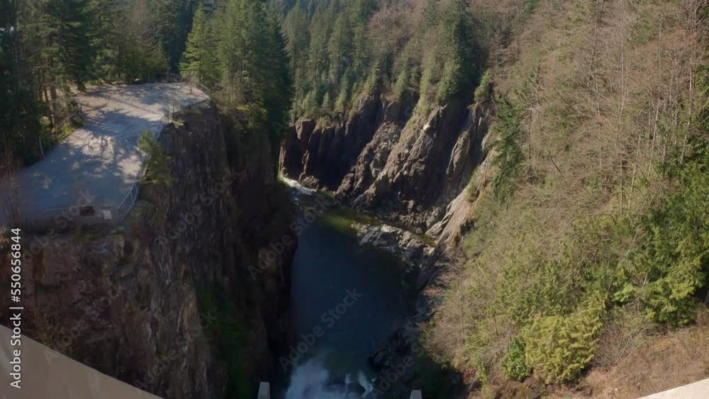 Cleveland Dam Spillway Capilano River 4K UHD. Looking down the spillway ...