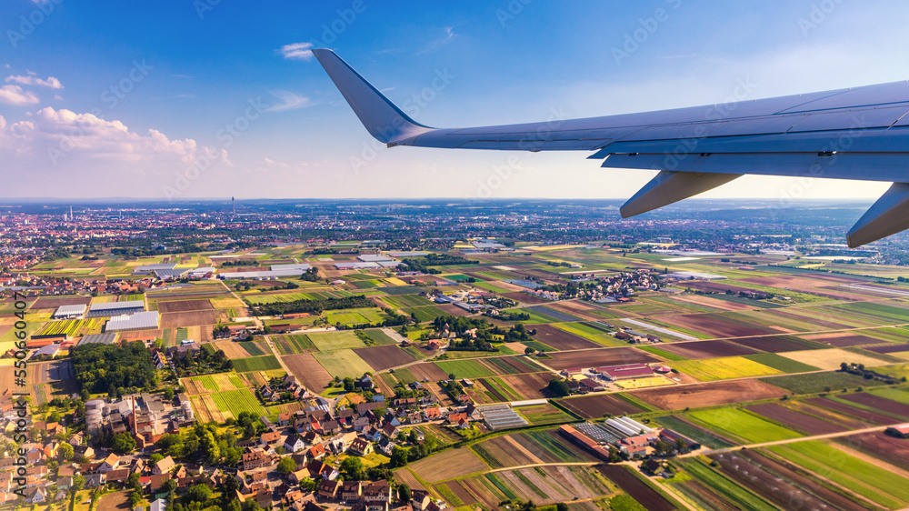Airplane windows view above the earth on landmark down. View from an ...