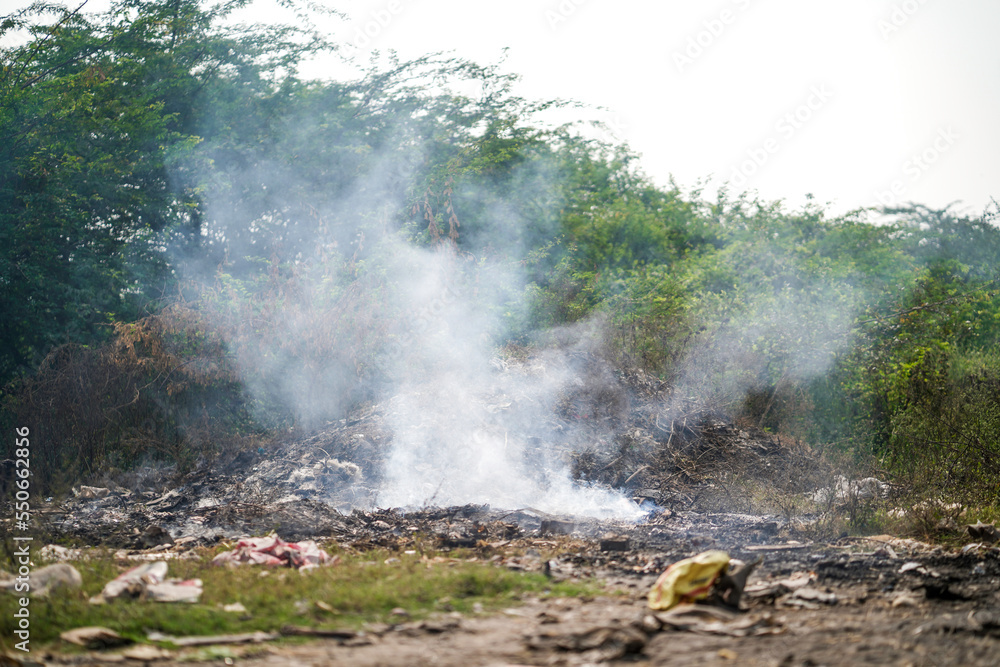 Garbage Dumping and burning site creating air pollution by smoke ...